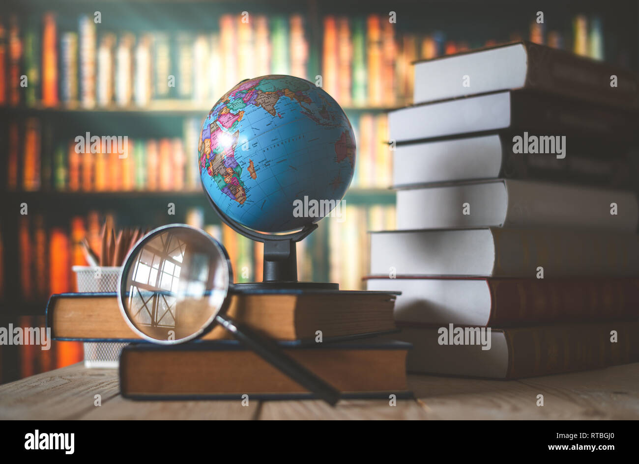 World globe on book. education school Concept Stock Photo - Alamy
