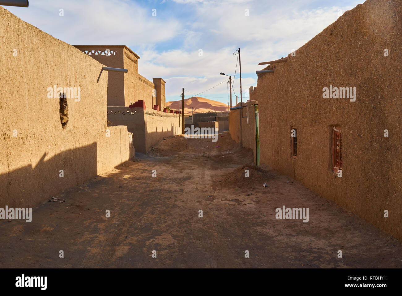 Amazing view of poor street between ancient houses in Marrakesh ...