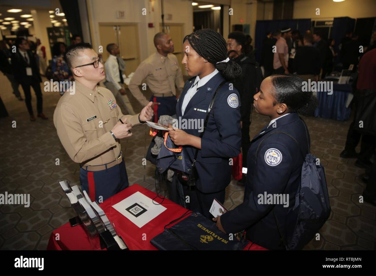 WASHINGTON — Maj. David Hankle speaks to Savannah Washington (left) and ...
