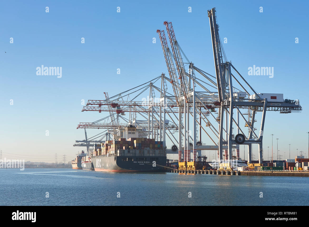 Container Ships Loading And Unloading Shipping Containers At The ...