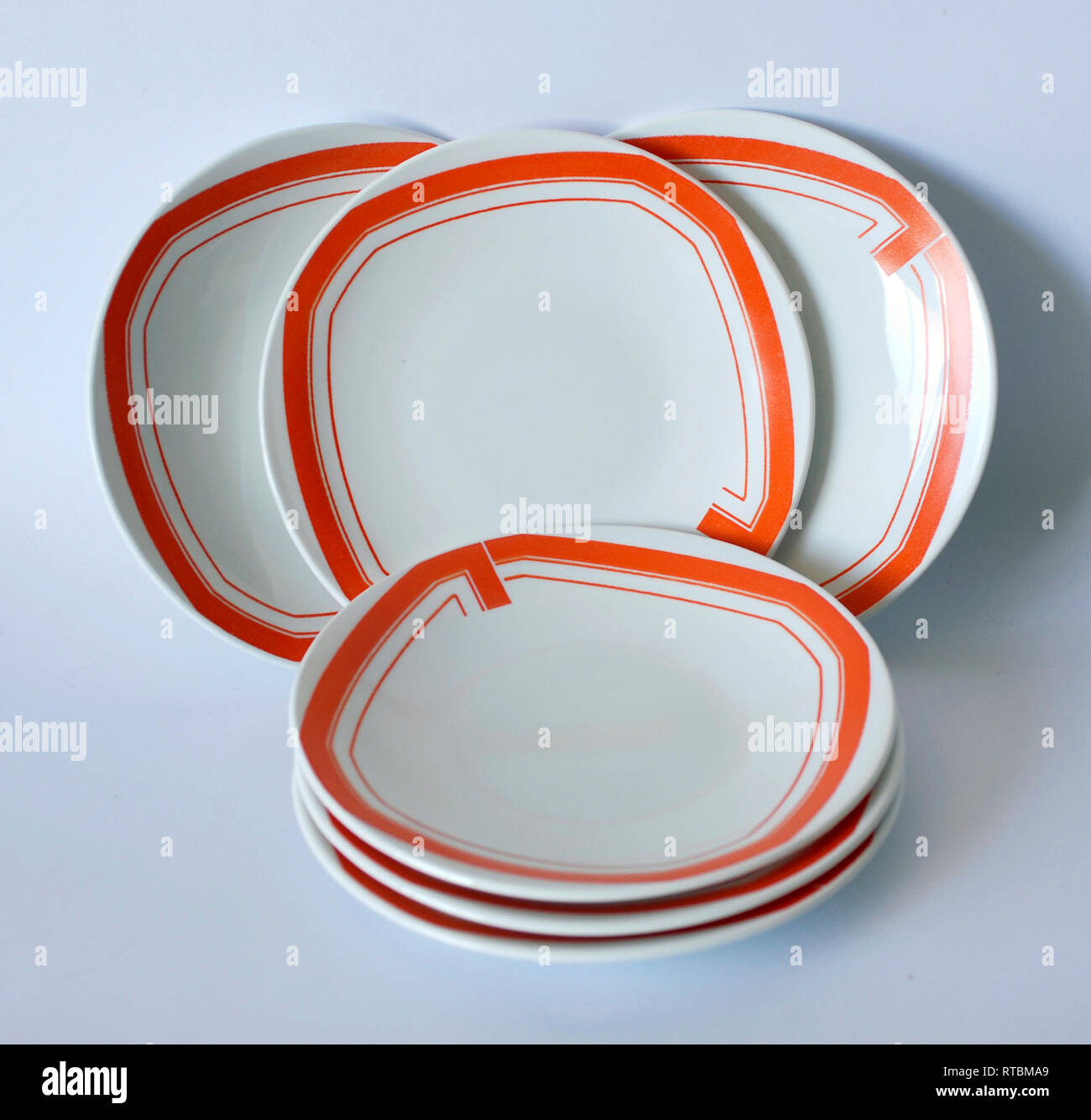 Set of vintage ceramic plates, orange and white colors Stock Photo - Alamy