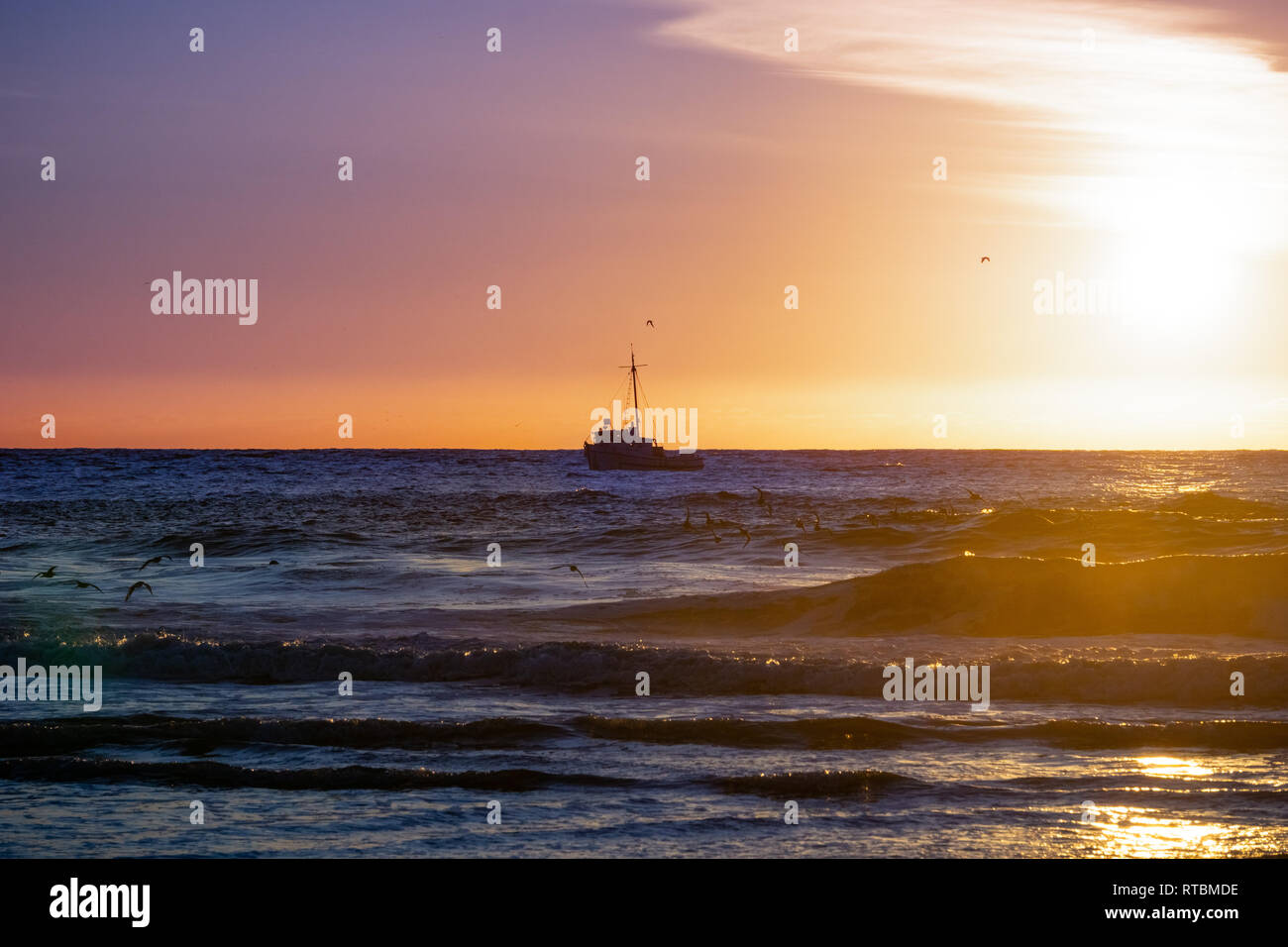 Ship heading to the harbor, at sunset, Moss Landing, California Stock ...