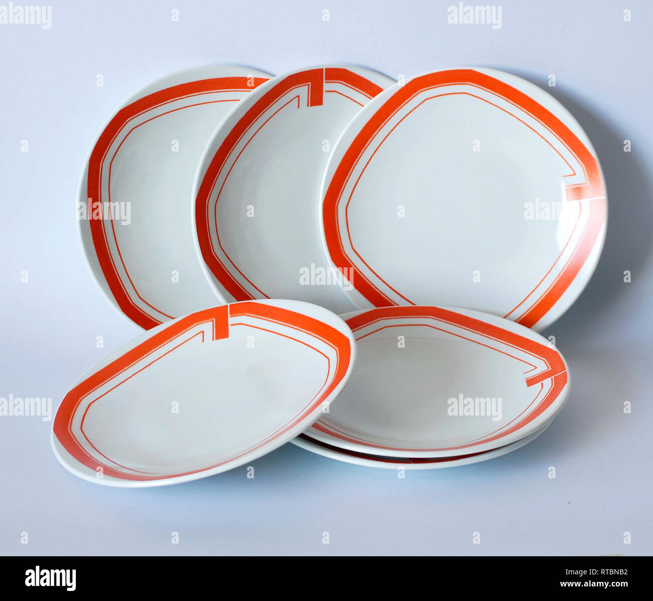 Set of vintage ceramic plates, orange and white colors Stock Photo - Alamy
