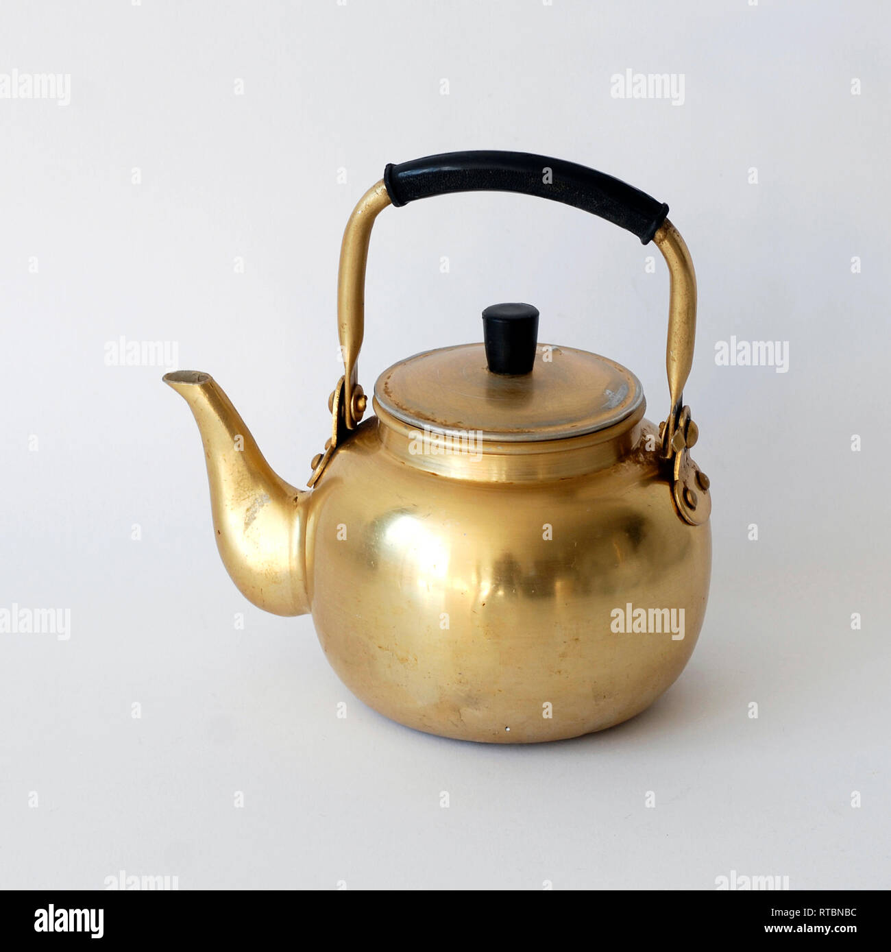 Beautiful golden vintage kettle isolated on white background Stock ...