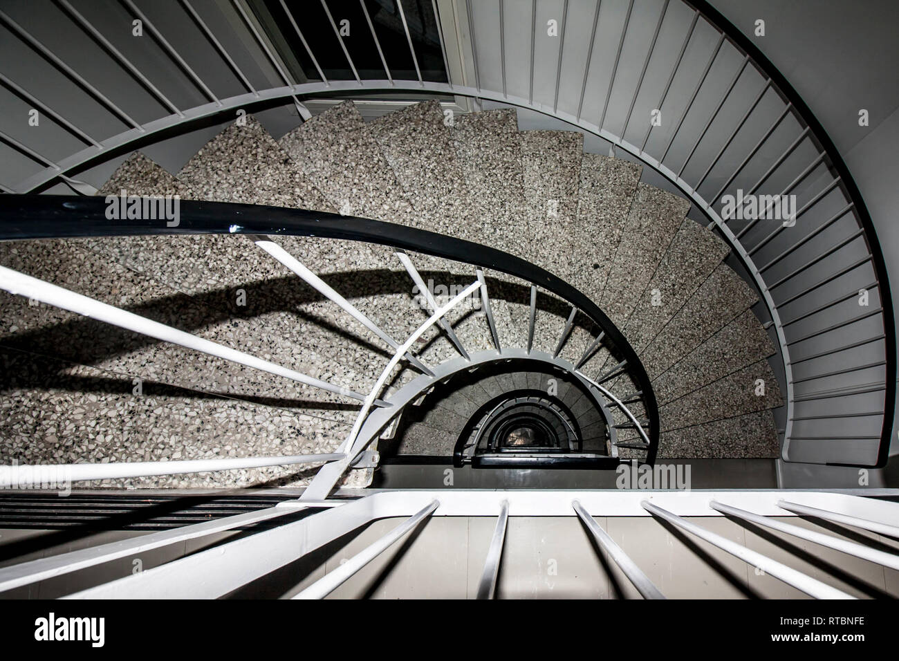 Top view of modern spiral staircase. Interior of multi-storey ...