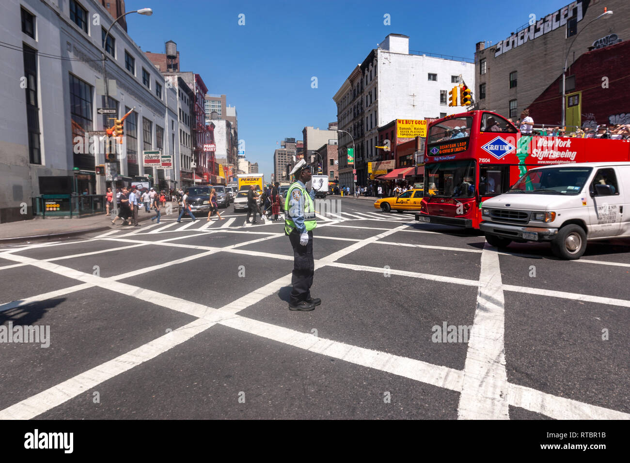 Traffic police controlling the traffic in Broadway and Canal Street ...
