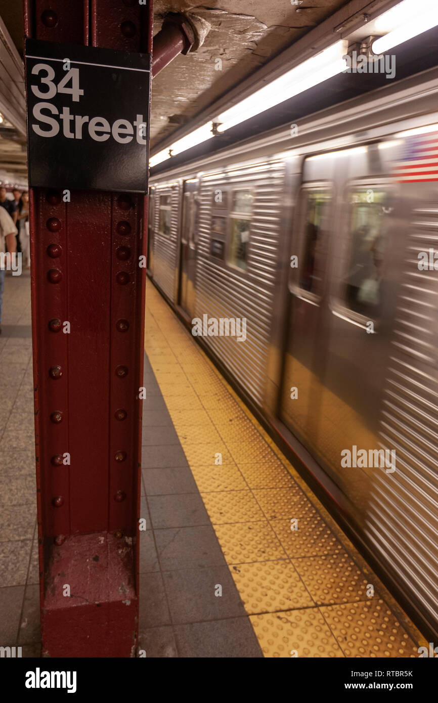 Subway leaving the 34 Street Subway station, Manhattan, New York USA ...