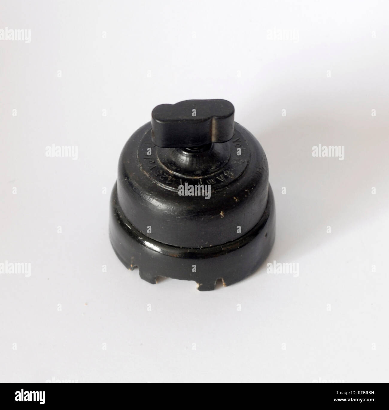 Old black bakelite switch, isolated with white background Stock Photo ...