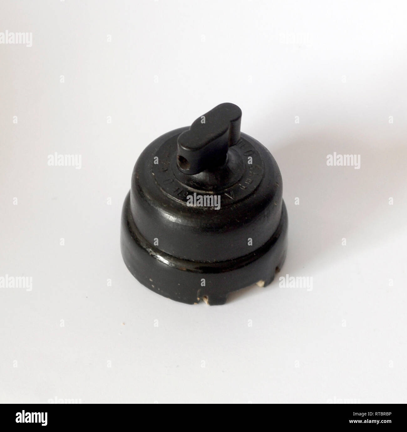 Old black bakelite switch, isolated with white background Stock Photo ...