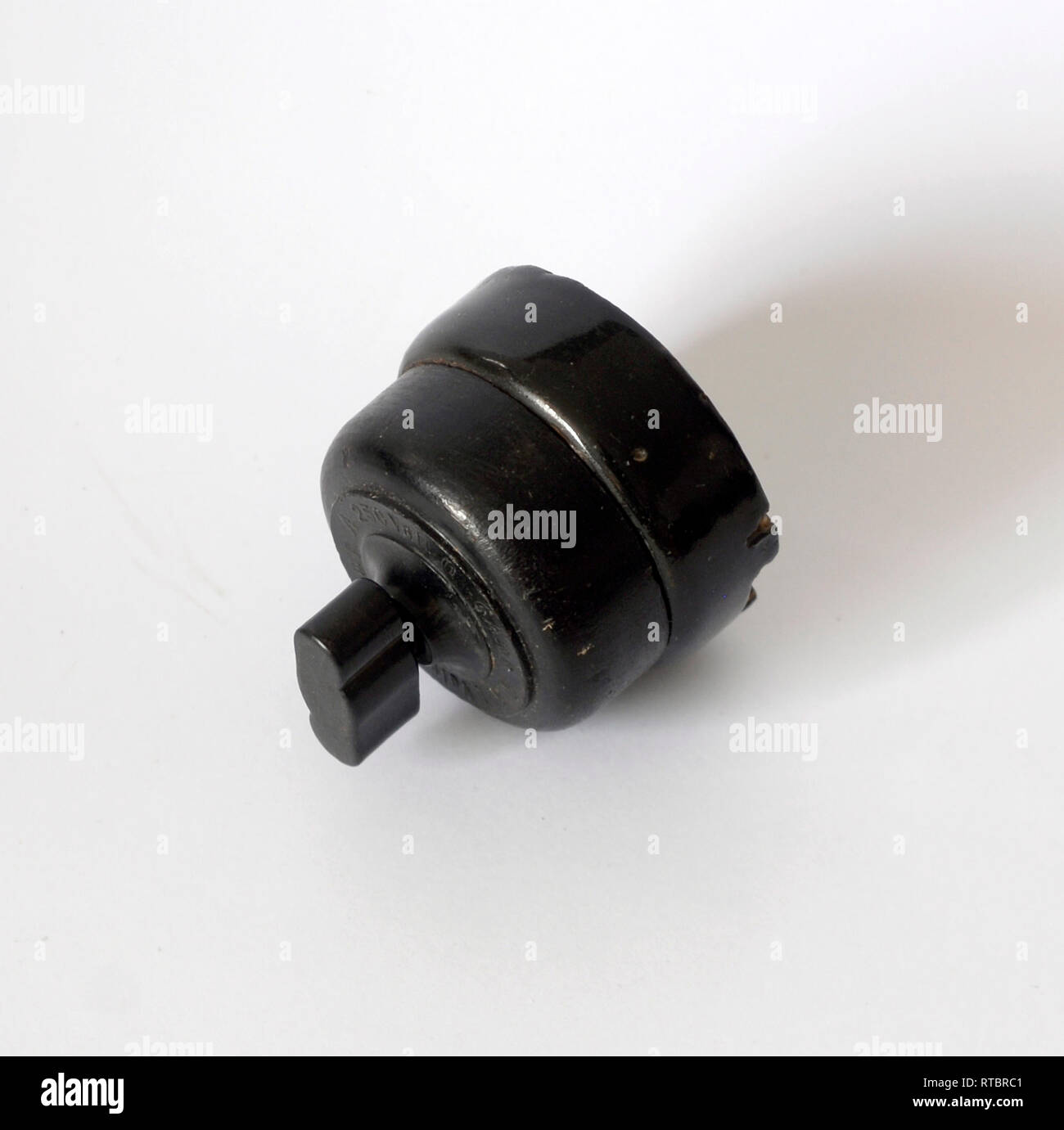 Old black bakelite switch, isolated with white background Stock Photo ...