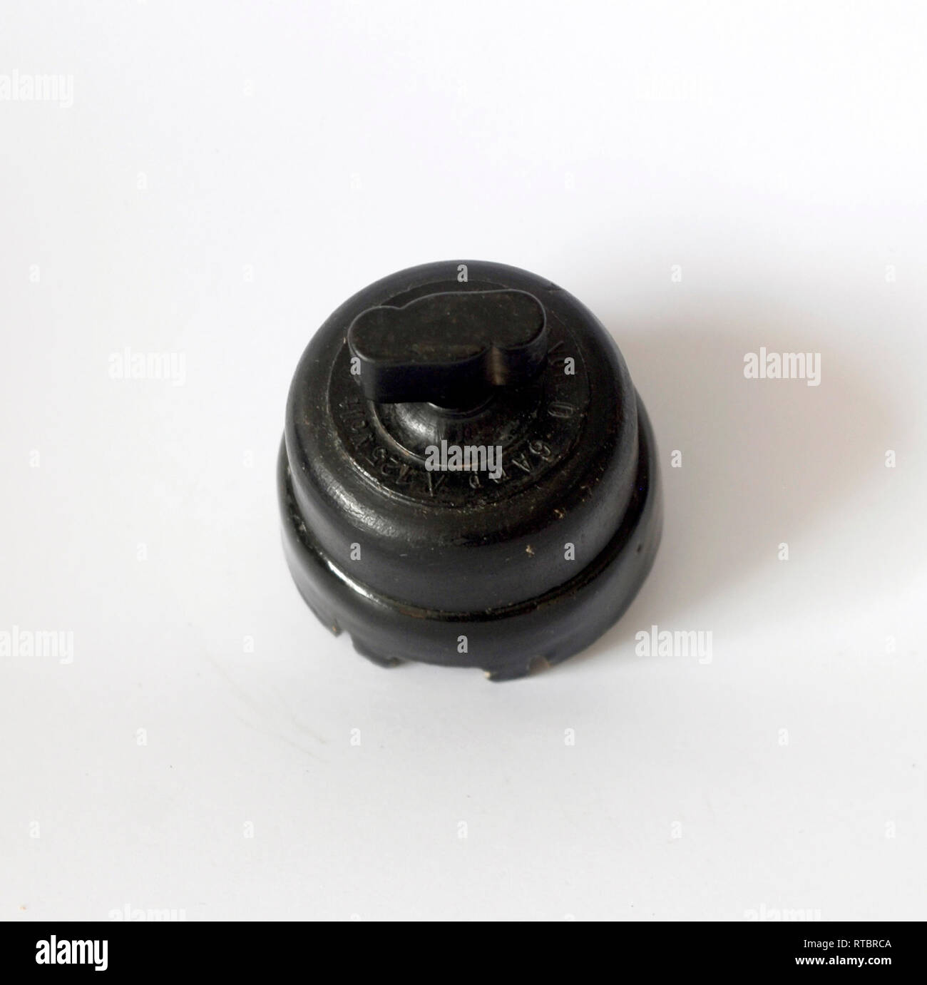 Old black bakelite switch, isolated with white background Stock Photo ...