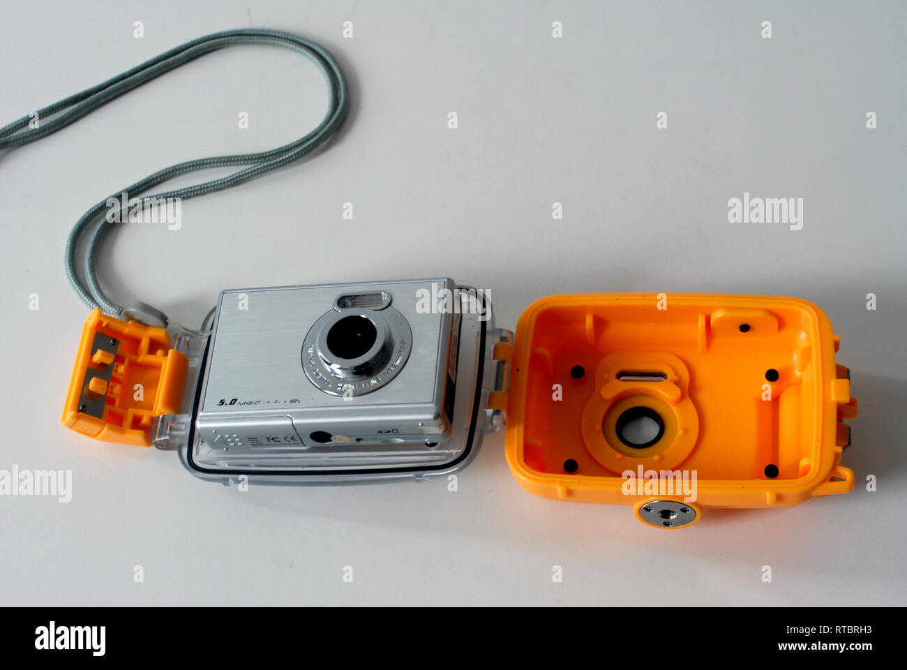 Small digital photo camera with hermetic protection for water ...