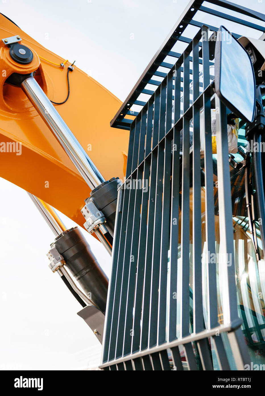 Detail of the excavator cabin protected by steel grill at modern ...
