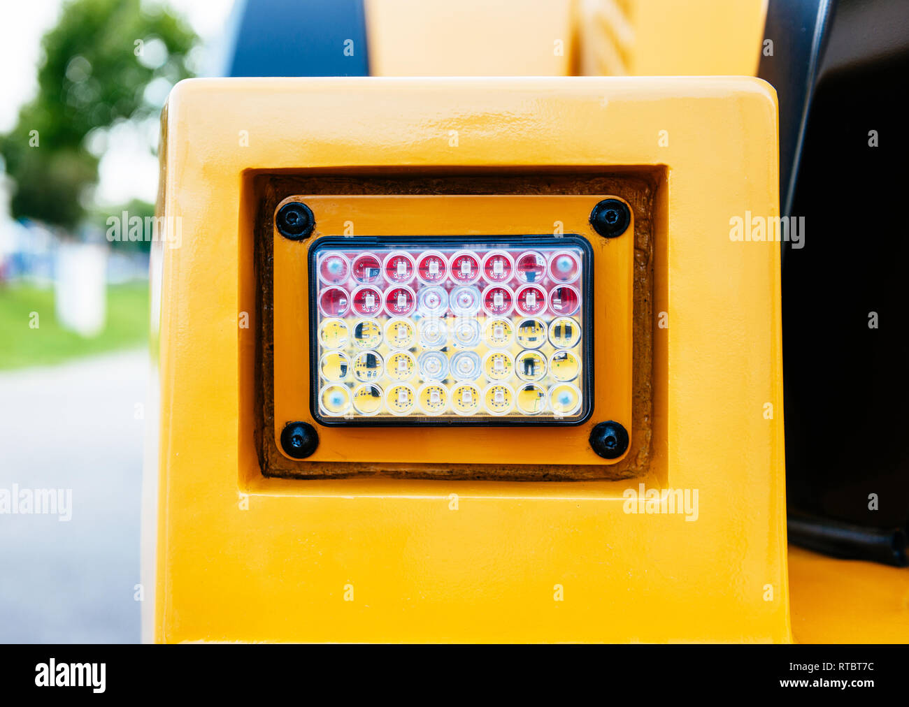 Detail of modern led light on modern excavator tractor at construction ...