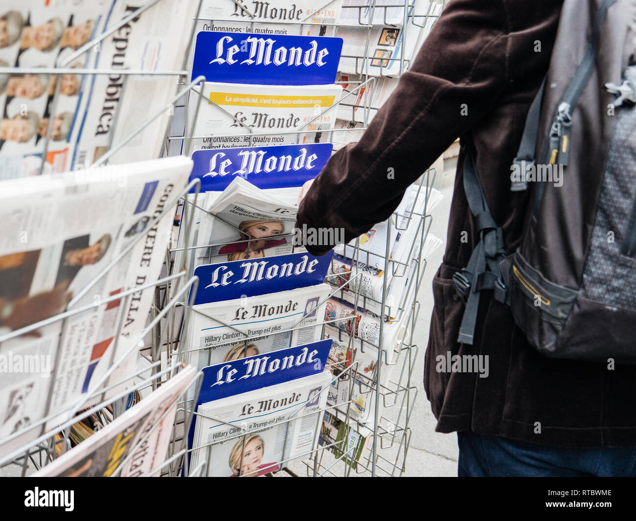 PARIS, FRANCE - SEP 23, 2017: Man buying latest French Le Monde ...
