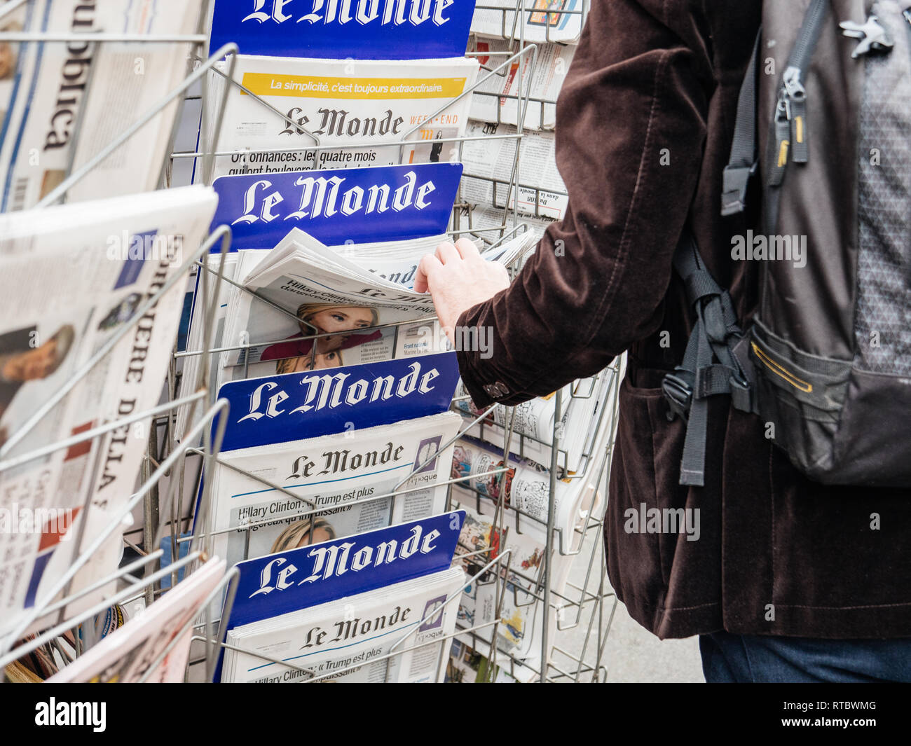 PARIS, FRANCE - SEP 23, 2017: Man buying latest French Le Monde ...