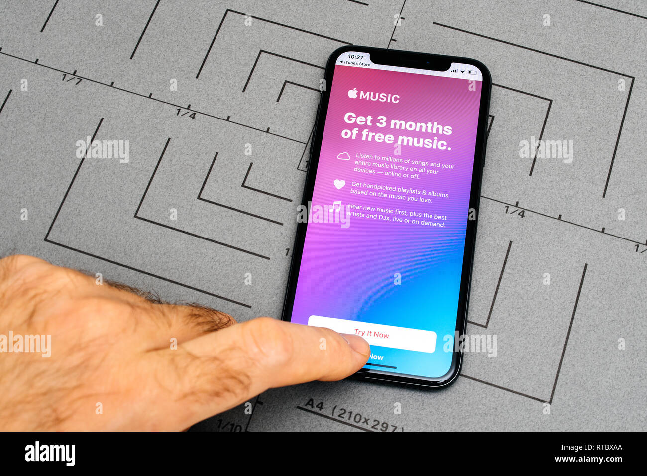 PARIS, FRANCE - NOV 9, 2017: Male hand touch selecting New Apple iPhone ...