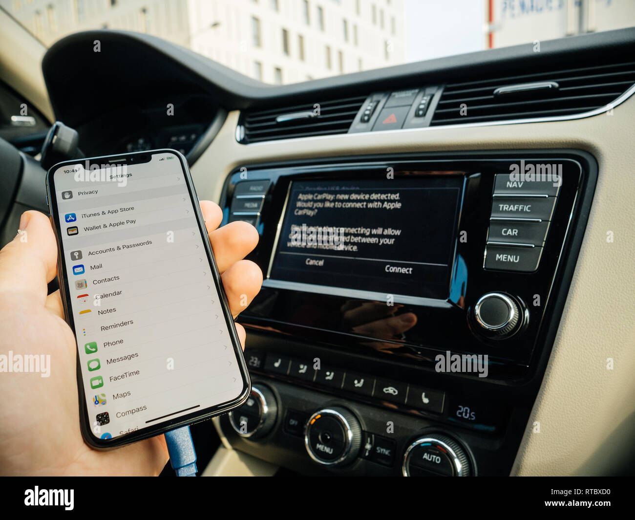 FRANKFURT, GERMANY - NOV 4, 2017: Man connecting his new iPhone X 10 to ...