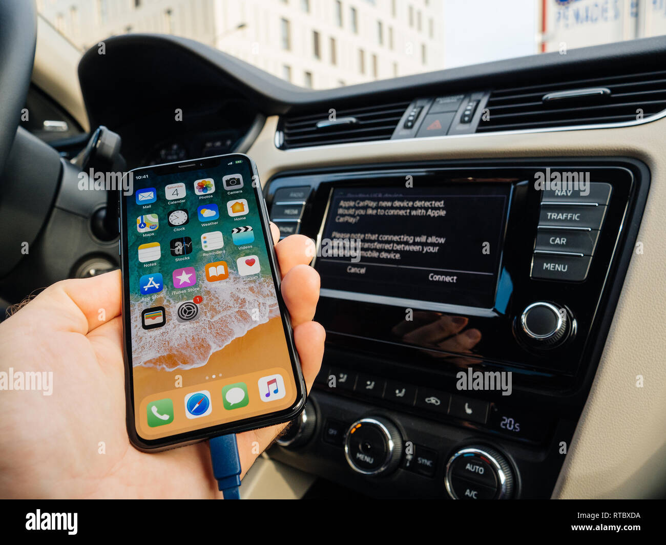 FRANKFURT, GERMANY - NOV 4, 2017: Man connecting his new iPhone X 10 to ...