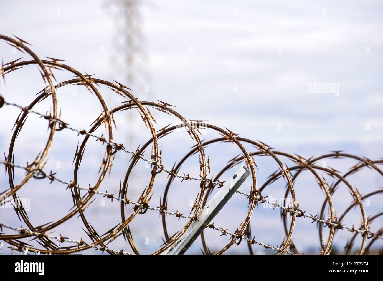 Razor barbed wire security fence, California Stock Photo - Alamy