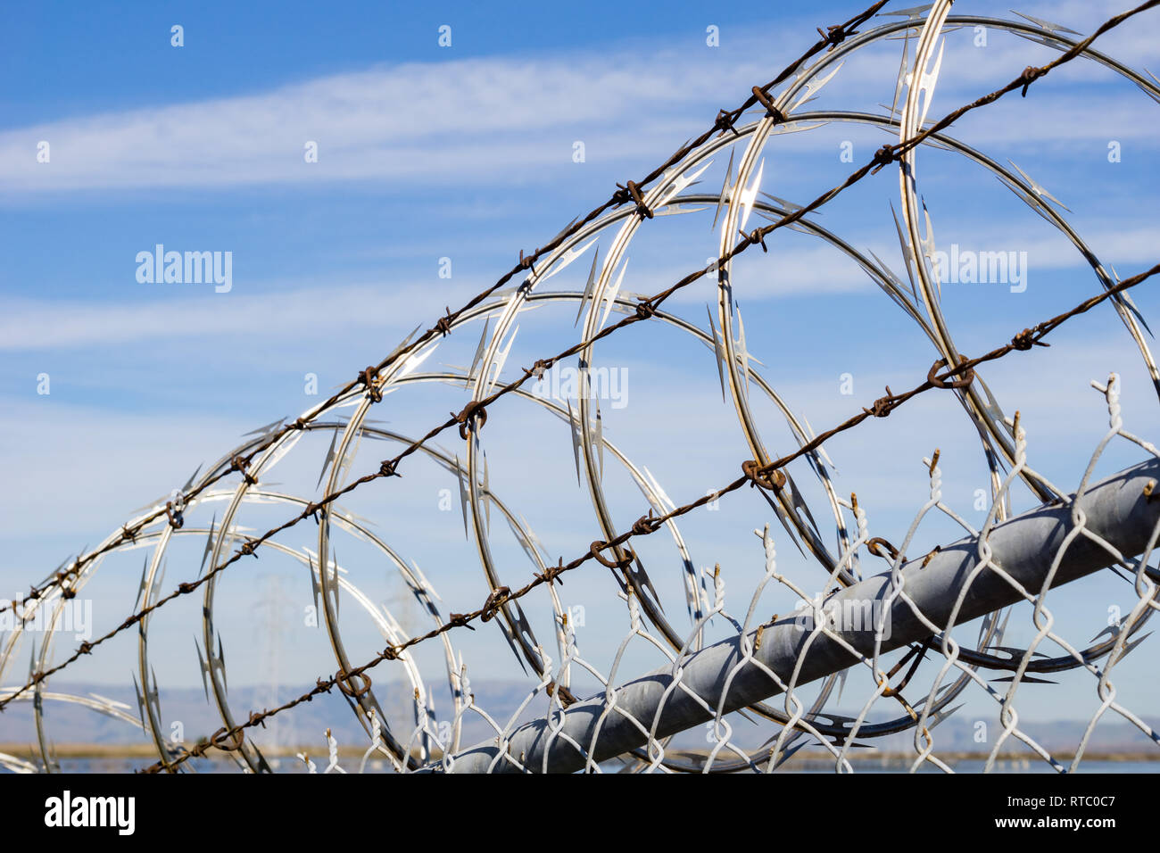 Razor barbed wire security fence, California Stock Photo - Alamy