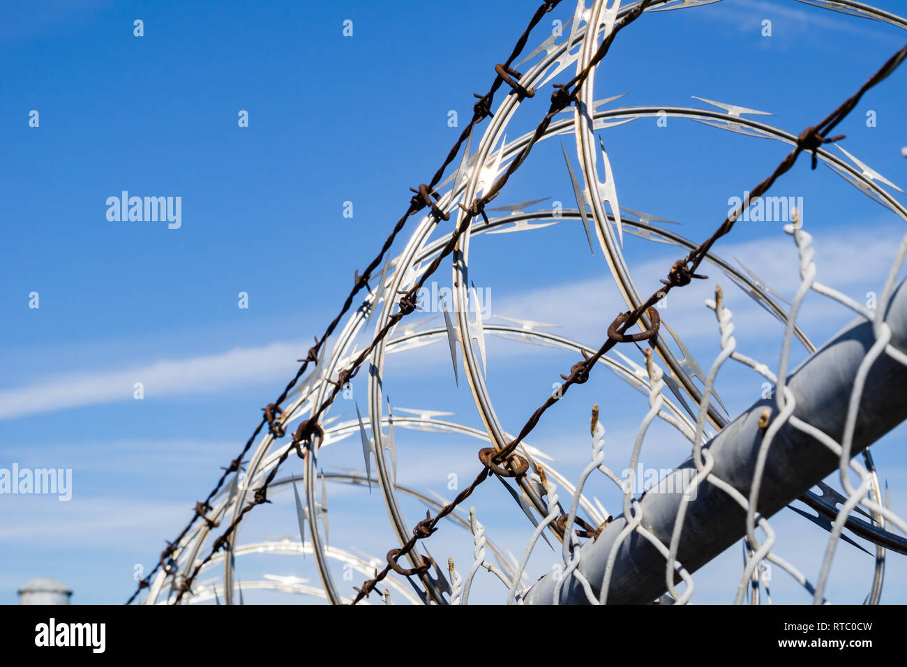 Razor barbed wire security fence, California Stock Photo - Alamy