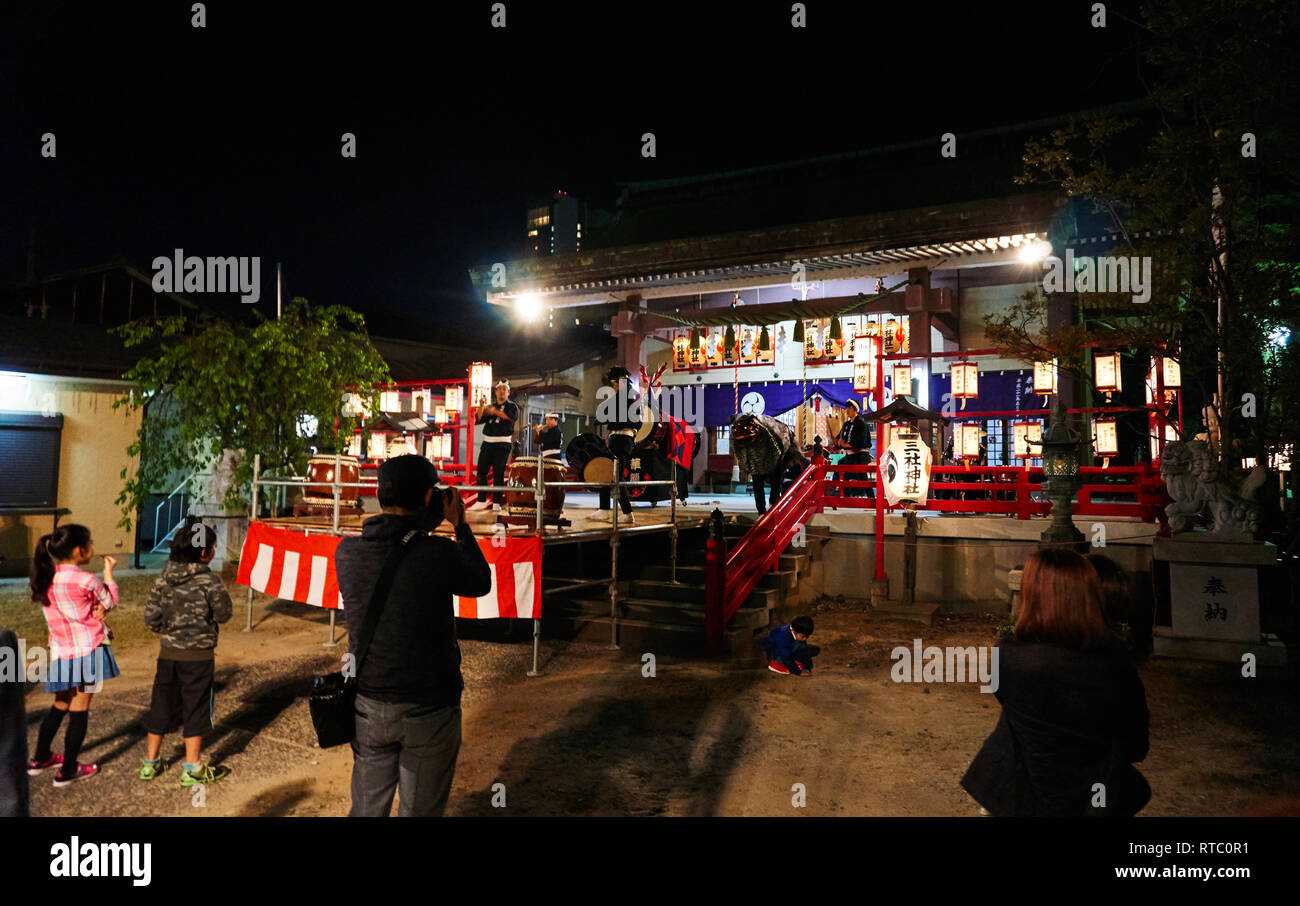 Locals enjoy a Lion dance and traditional music on taiko drums and ...