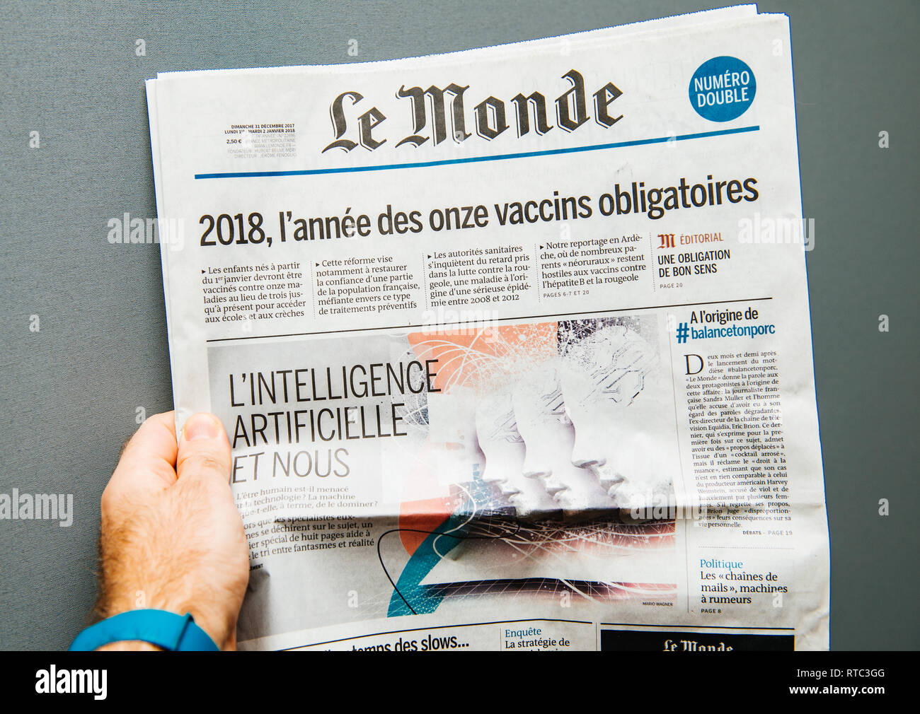 Paris, France - Jan 8, 2018: Man holding Le Monde Newspaper with title ...