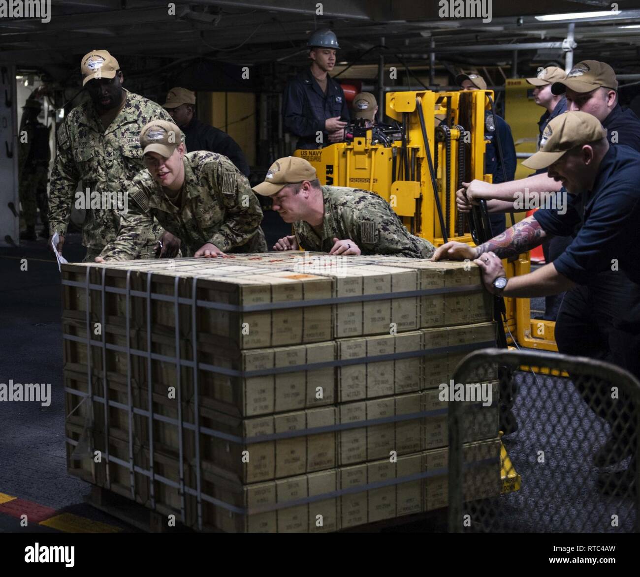 NORFOLK, Va. (Feb. 8, 2019) Sailors load munitions onto a weapons ...