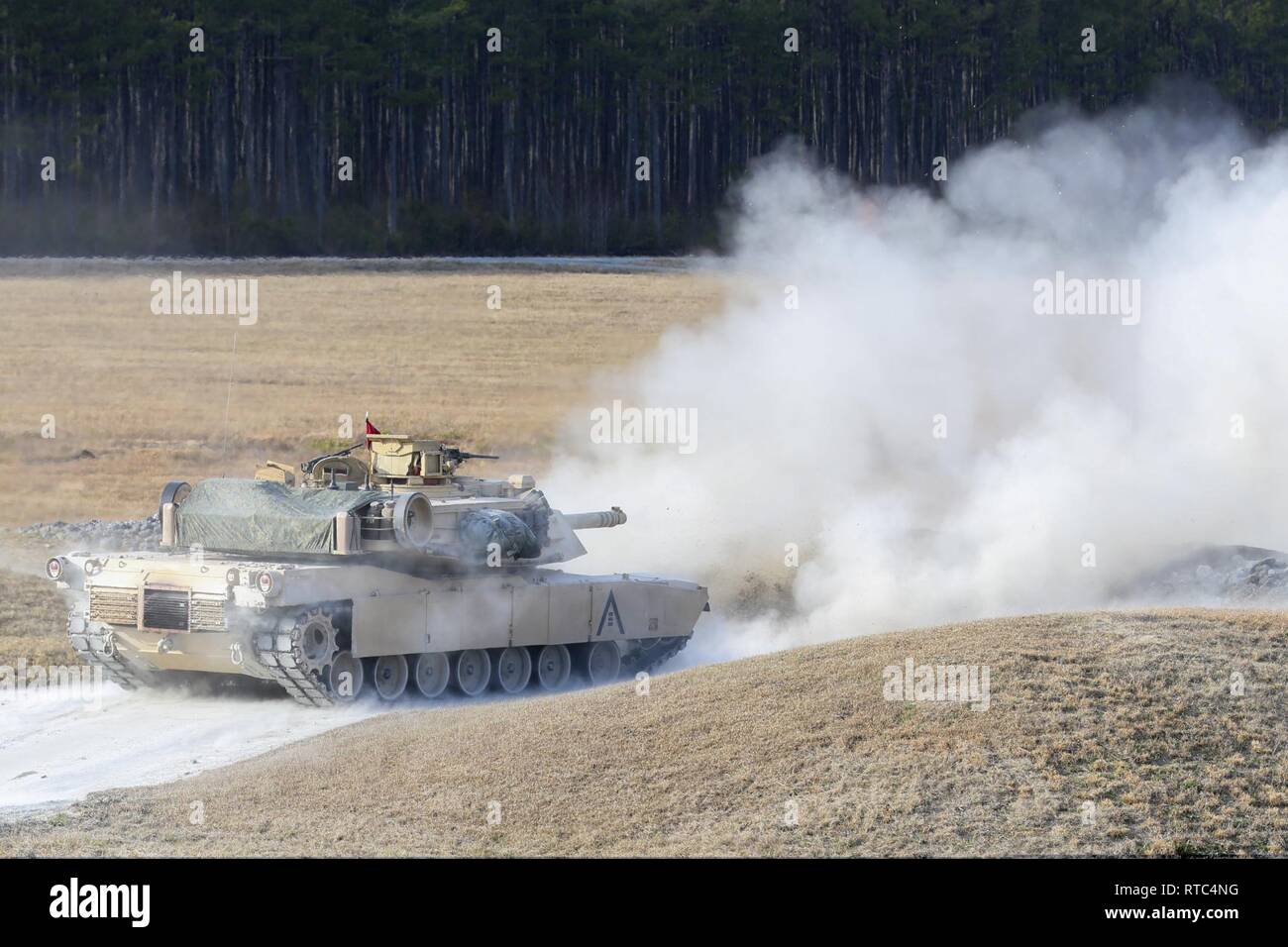 U.S. Marines with 2nd Tank Battalion, 2nd Marine Division fire a 120mm ...