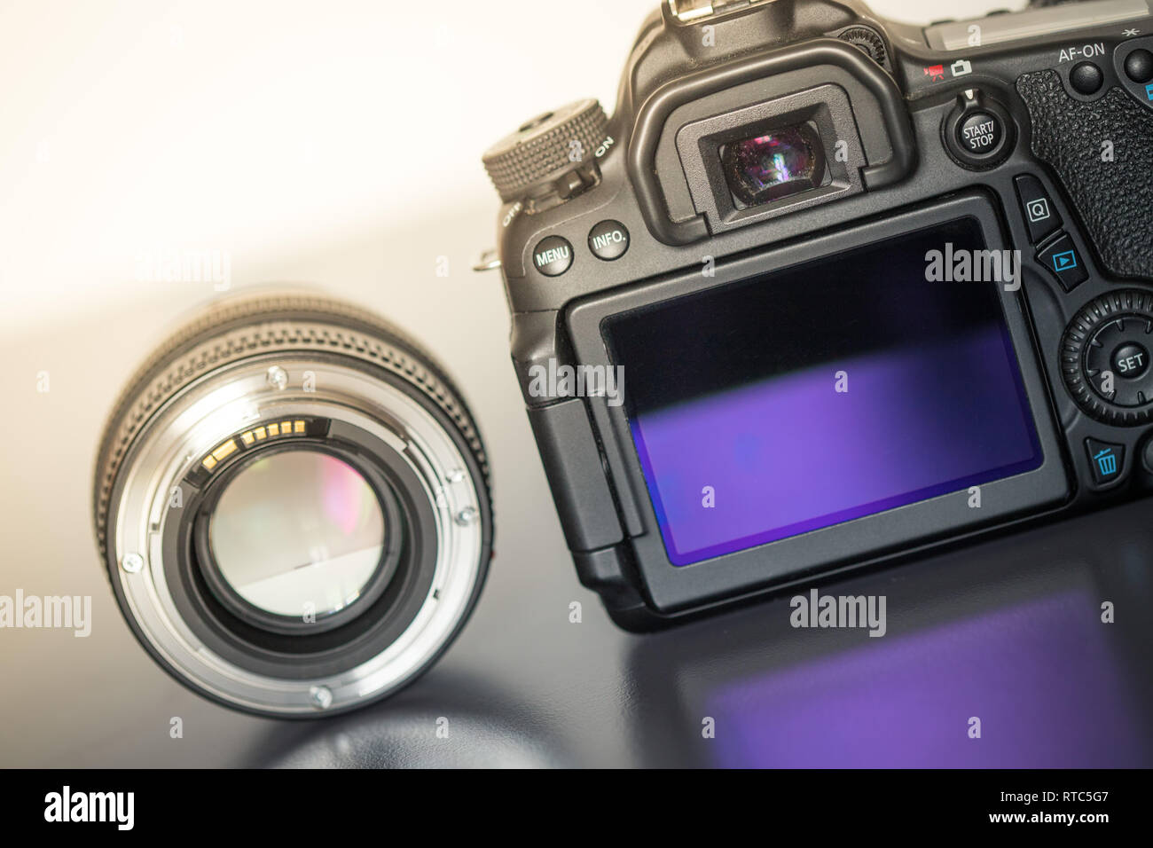 Back view of a professional reflex camera with flip lsd screen and a ...