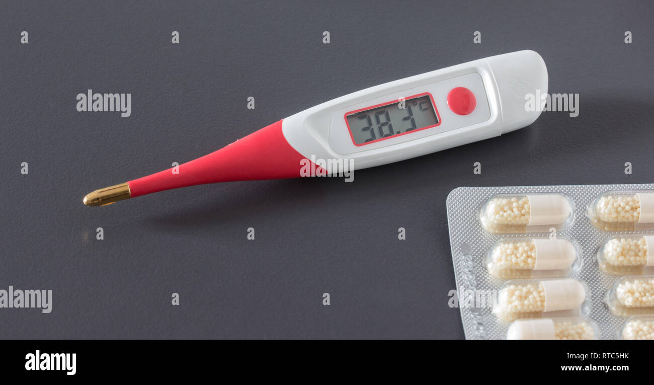 Fever thermometer on desk hi-res stock photography and images - Alamy