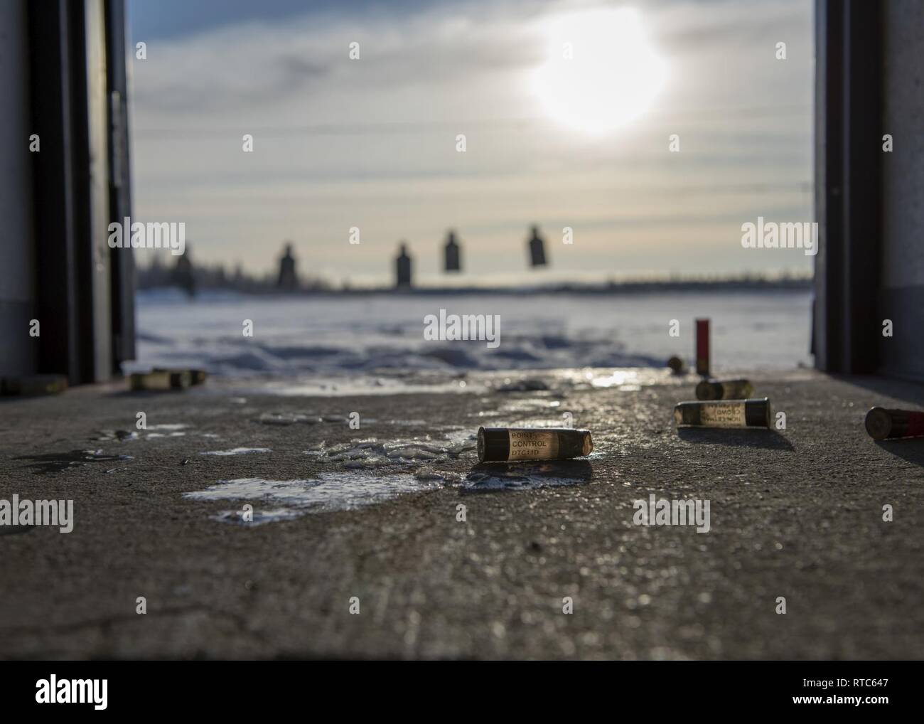 Spent shells are scattered across the floor during weapons training ...