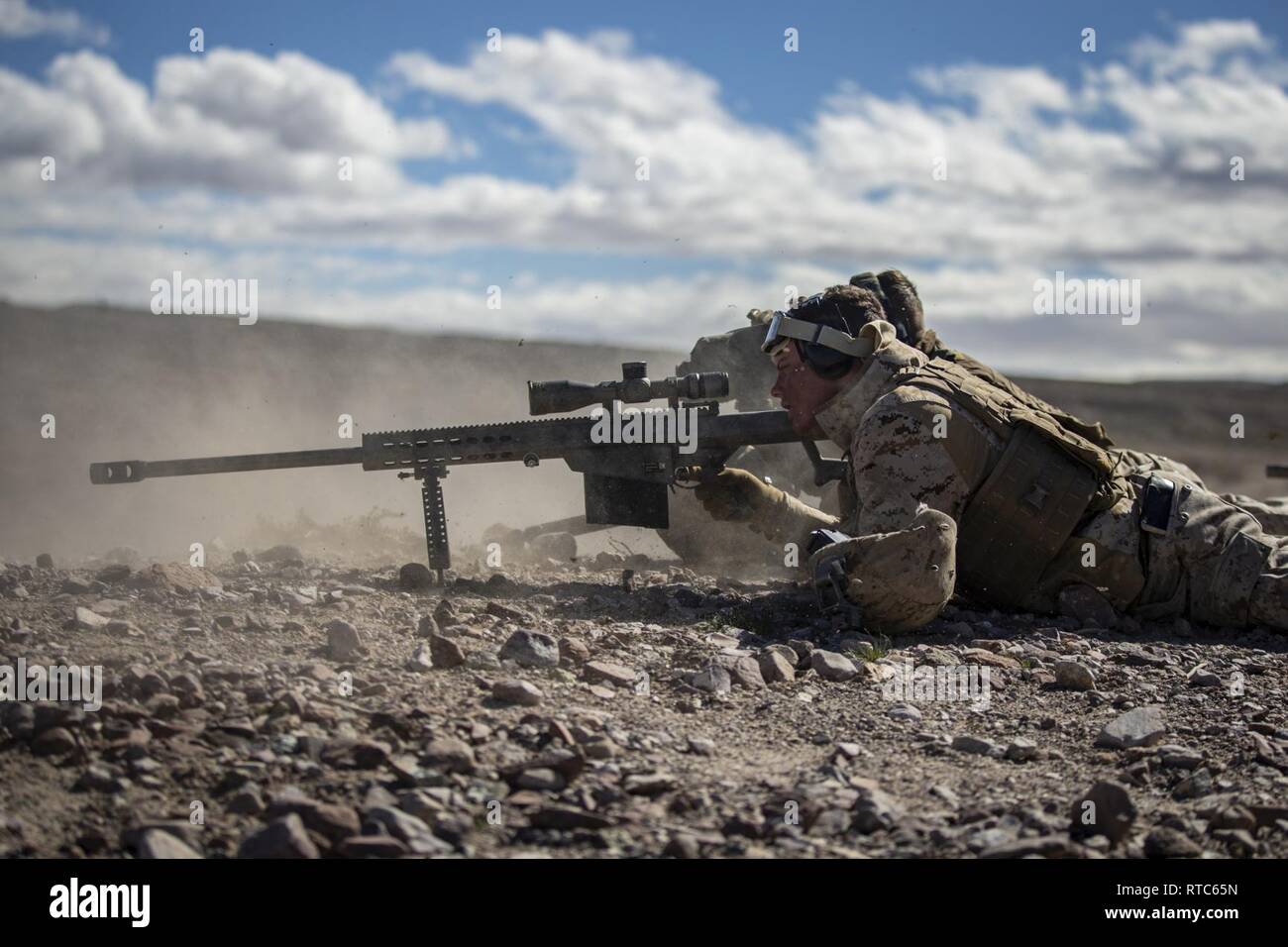 U.S. Marine Lance Cpl. Bryce Hopkins, a scout sniper with 3rd Battalion, 3rd Marine Regiment ...