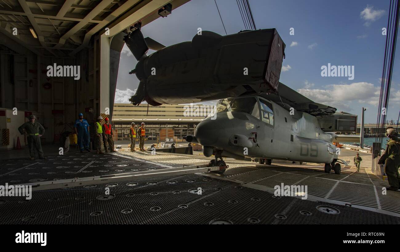 U.S. Marines with Marine Medium Tiltrotor Squadron 268 (VMM-268) load ...