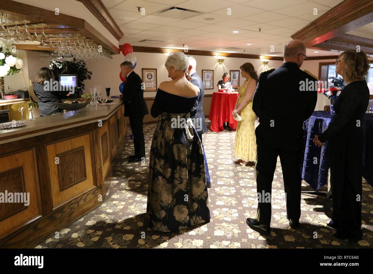 Guests mingle and enjoy themselves during Social Hour at the Centennial ...