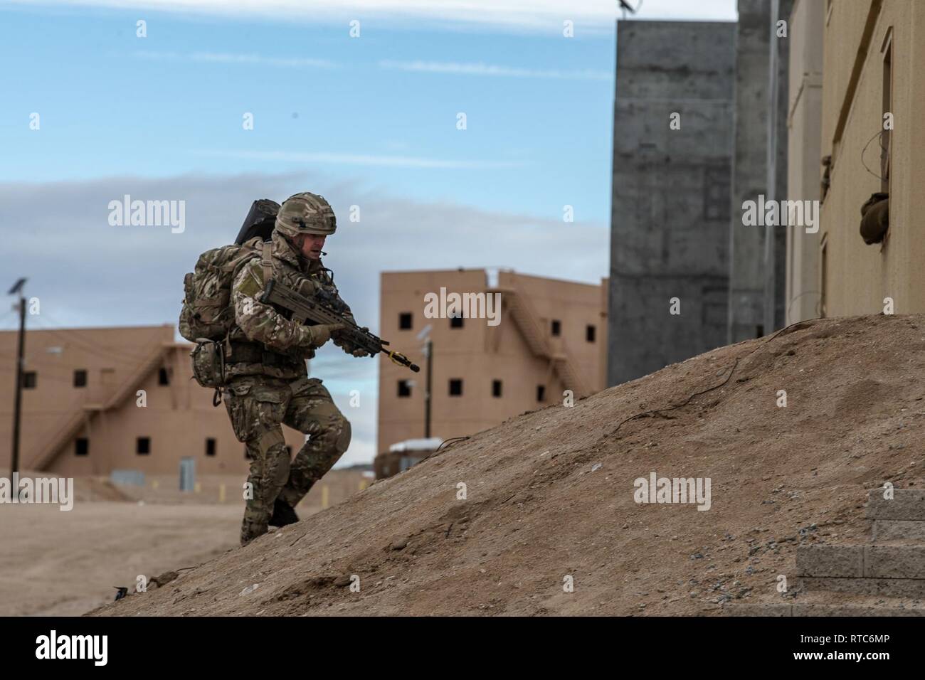 A U.K. Royal Marine with 45 Commando advances position during ...