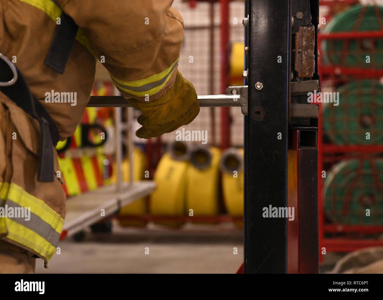 A firefighter from the 104th Civil Engineering Squadron practices ...