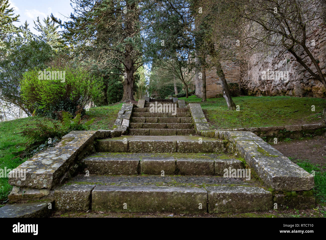 Stairs of a stone path passing through the medieval center of Girona ...