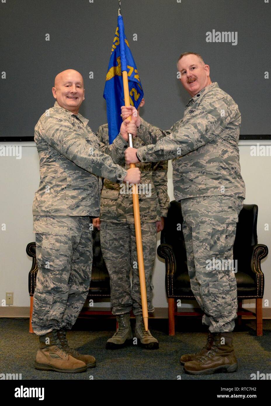 Col. Richard Ropac, 507th Mission Support Group commander, hands the ...