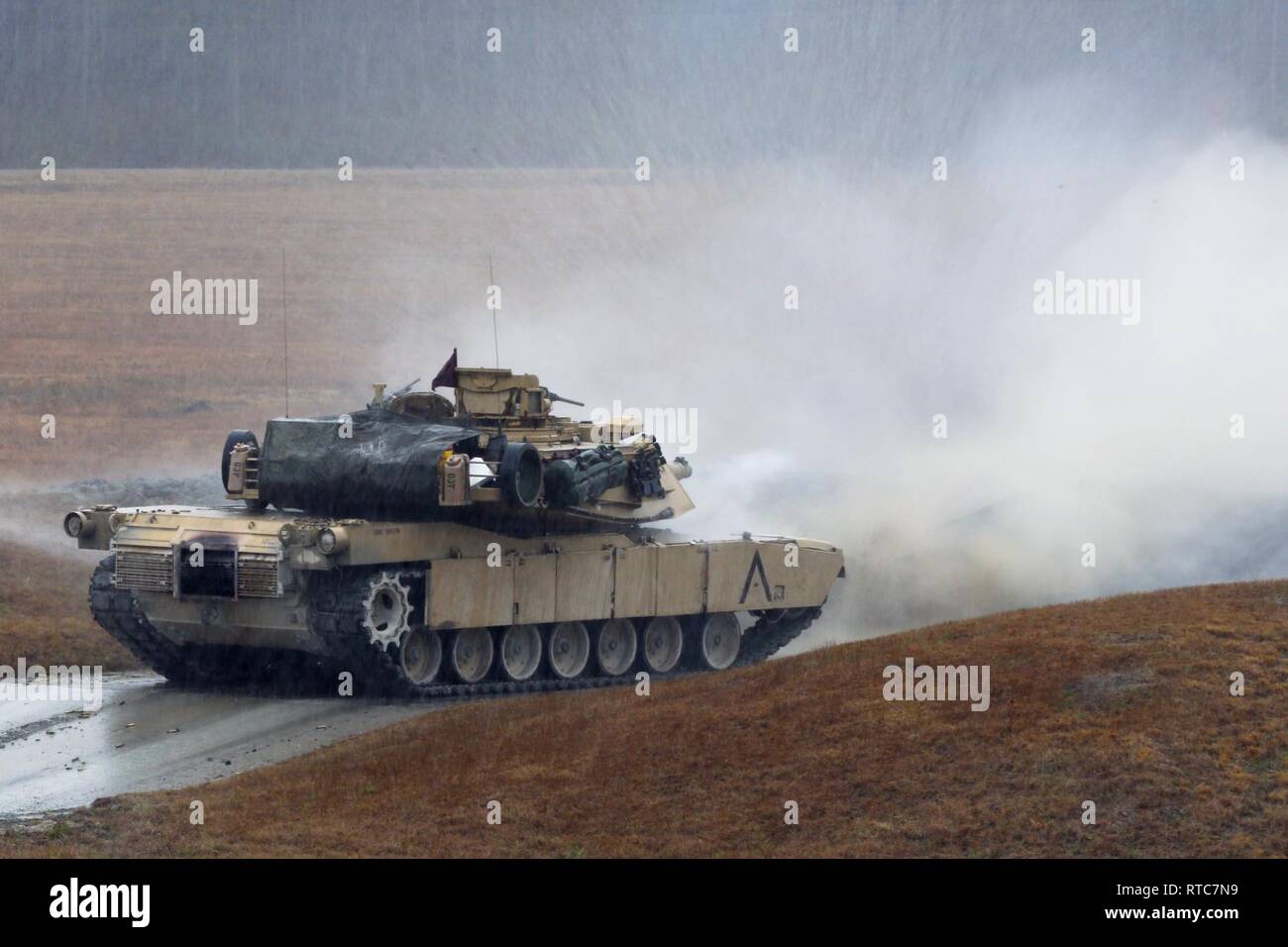 U.S. Marines with 2nd Tank Battalion, 2nd Marine Division fire a 120mm ...