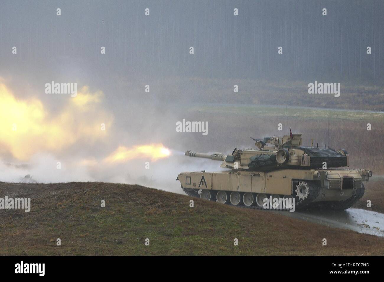U.S. Marines with 2nd Tank Battalion, 2nd Marine Division fire a 120mm ...