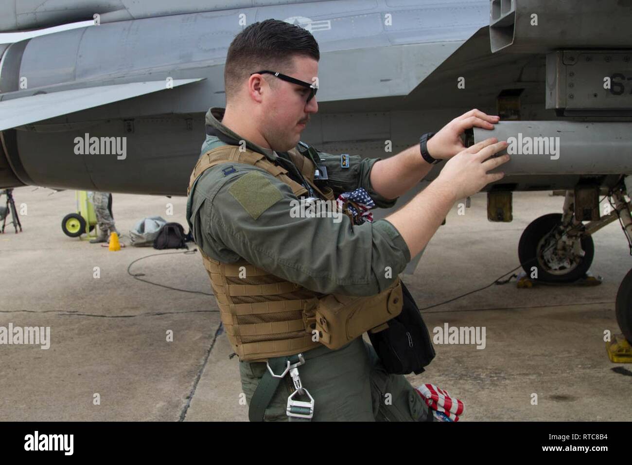 U.S. Air Force Capt. Brendan “Beastie” Boyd, performs pre-flight checks ...