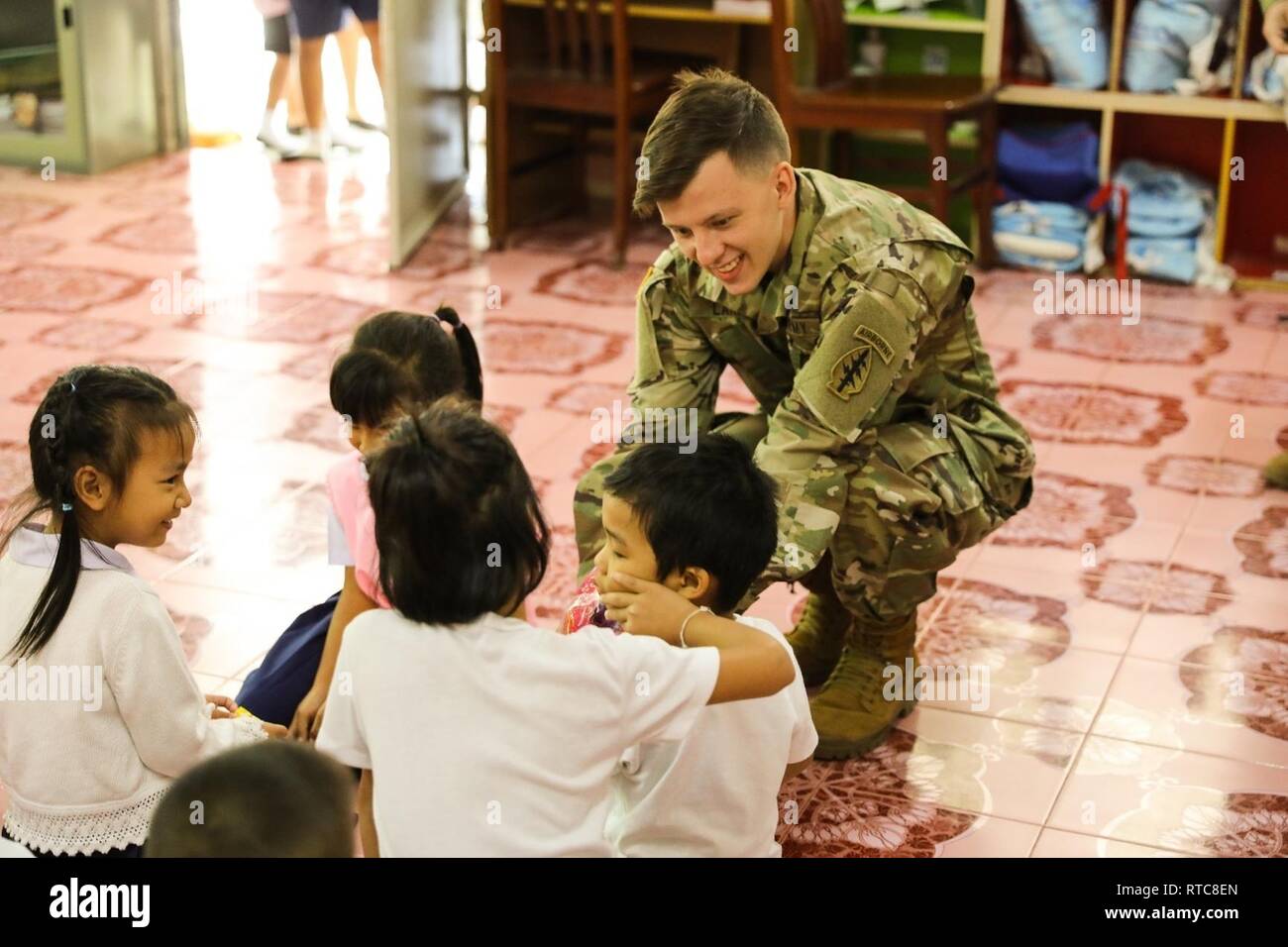 Sgt. Casey Larkin speaks to students at Ban Klong Bang Pai School ...