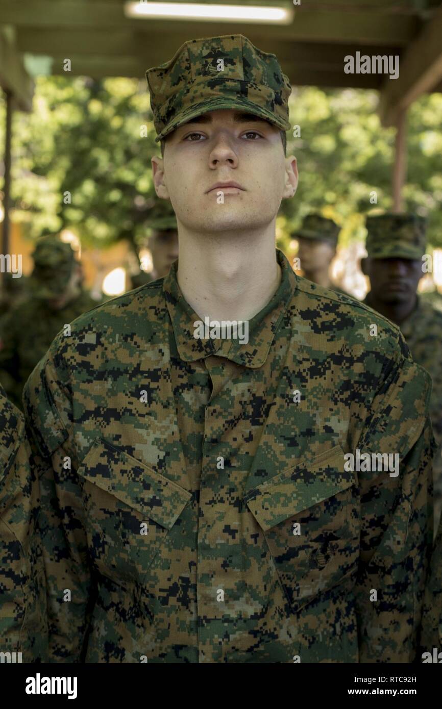 A recruit with Delta Company, 1st Recruit Training Battalion, stands at ...
