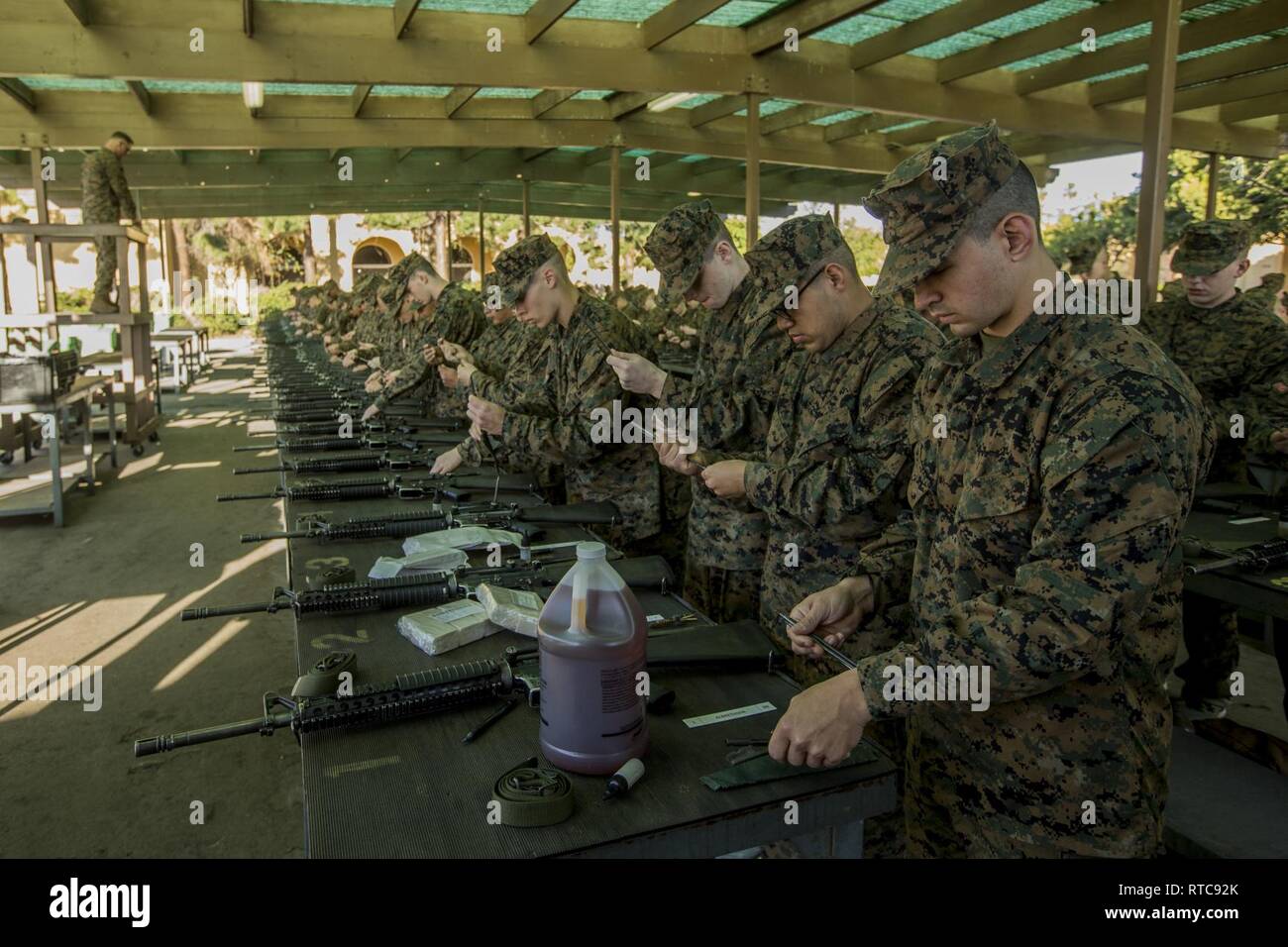 Recruits with Delta Company, 1st Recruit Training Battalion, take gear ...