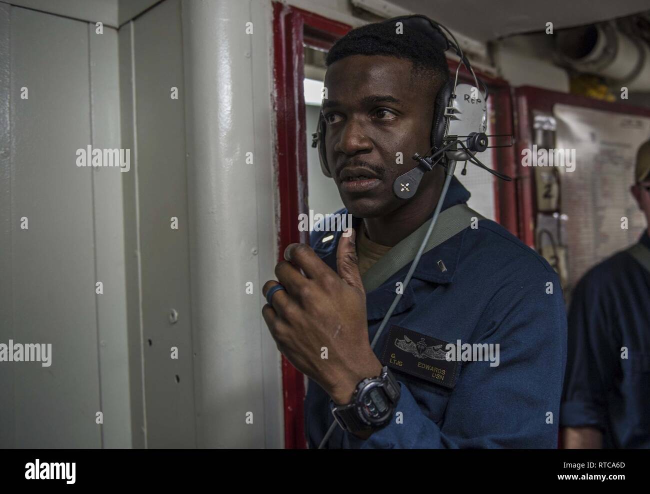 ATLANTIC OCEAN (Feb. 12, 2019) – Lt. j.g Greig Edwards acts a phone ...