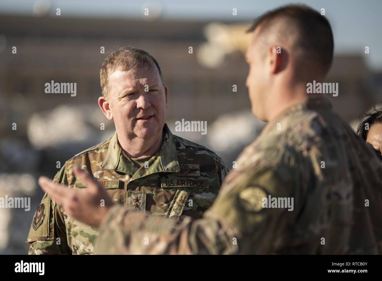 Lt. Gen. Richard Scobee, Air Force Reserve commander, is briefed by a ...