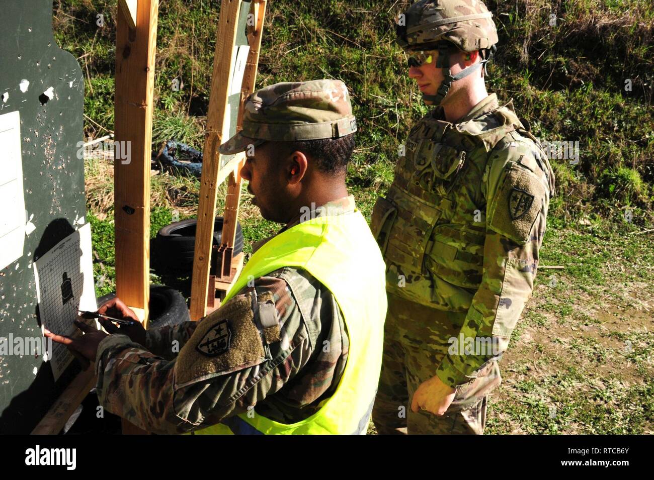 Left, U.S. Army NCOIC Sfc. Leron A. Corbin and OIC 1Lt. Taylor S ...