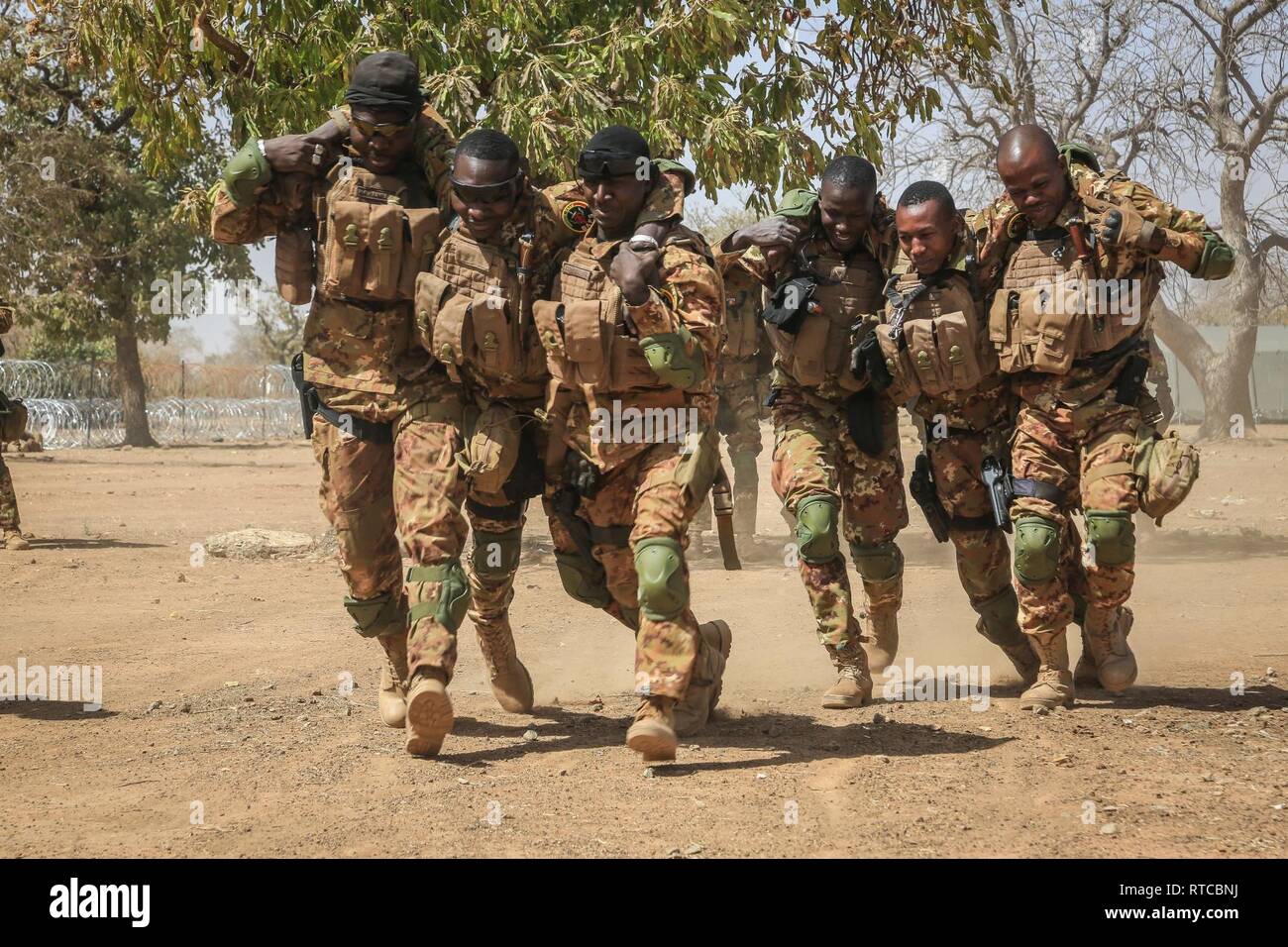 Malian soldiers practice buddy carries in Loumbila, Burkina Faso Feb ...